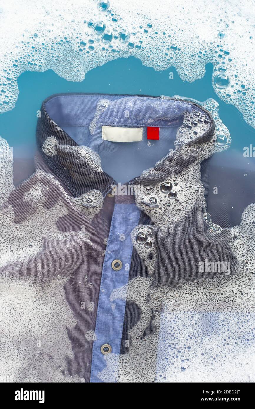 Shirt soak in powder detergent water dissolution, washing cloth ...