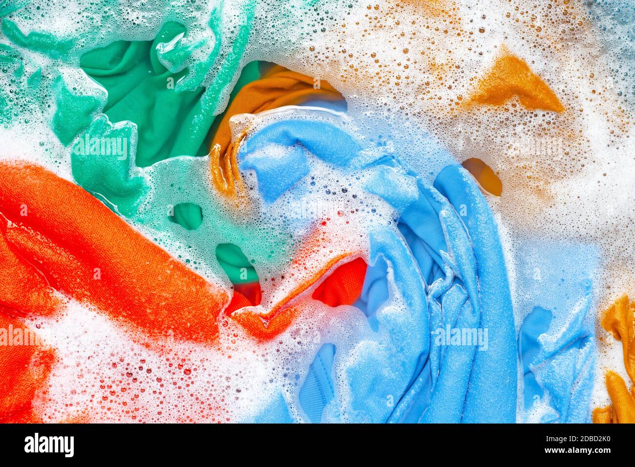 Color clothes soak before washing. Top view Stock Photo - Alamy