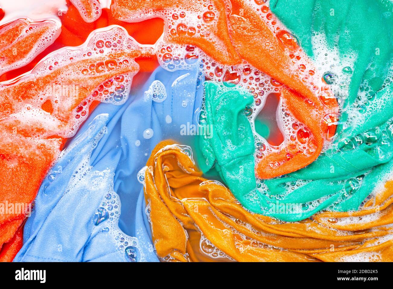 Color clothes soak before washing. Top view Stock Photo - Alamy