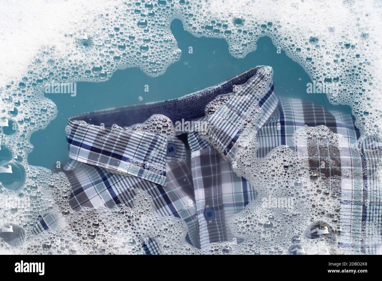 Shirt soak in powder detergent water dissolution, washing cloth ...