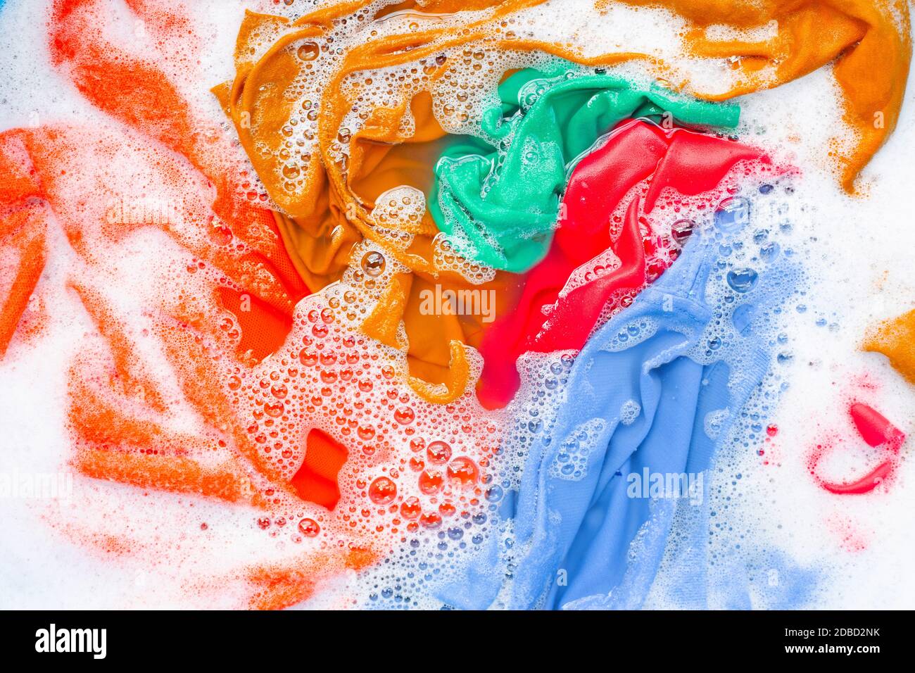 Color clothes soak before washing. Top view Stock Photo - Alamy