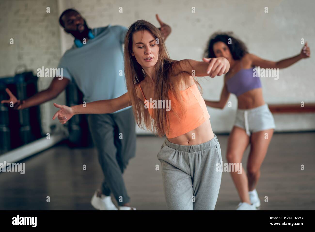 Woman learning hip-hop choreography with her groupmates Stock Photo - Alamy