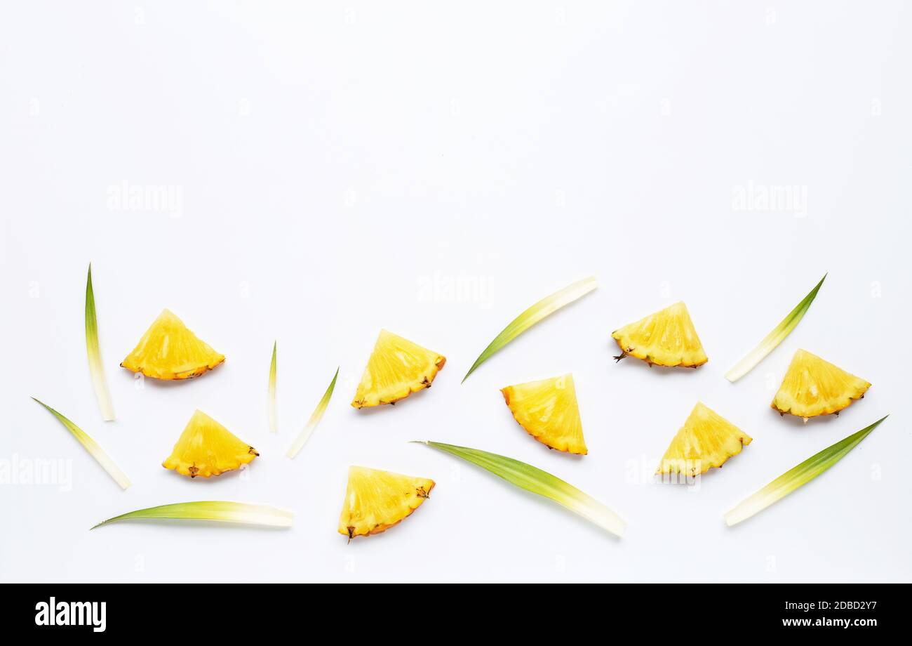 Fresh pineapple slices on white background Stock Photo - Alamy