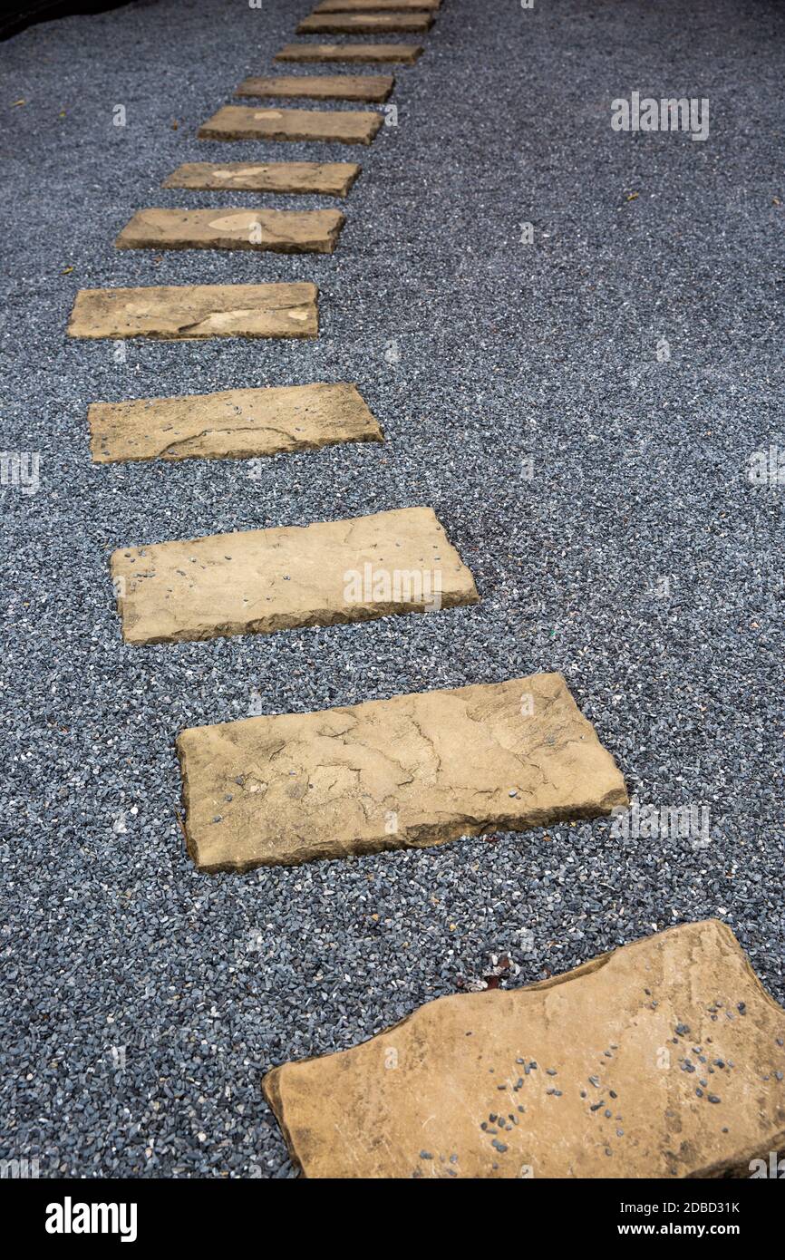 The Stone walk path in the asian park with grey small stones on ...
