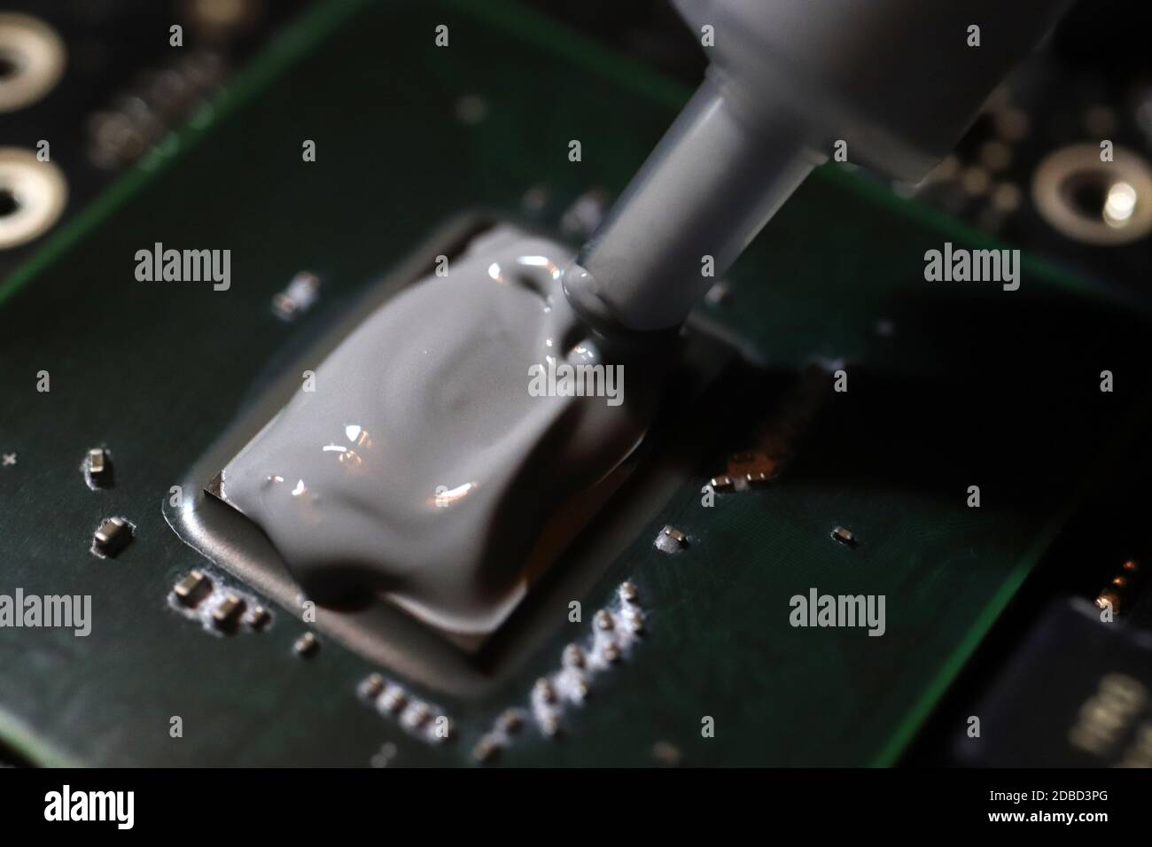 Applying thermal paste to the processor microchip Stock Photo - Alamy