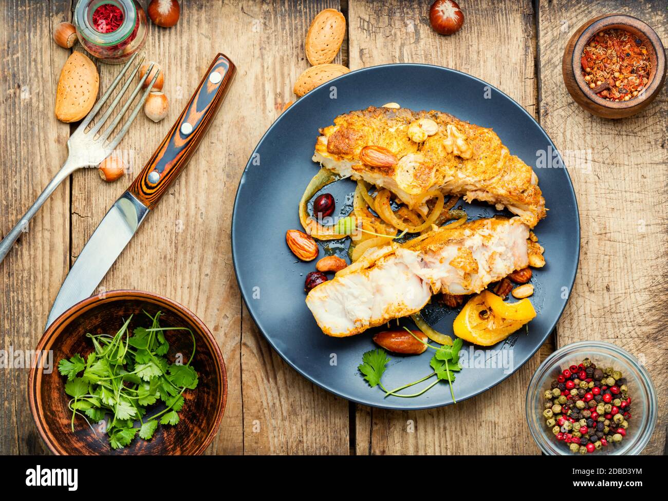 Roasted piece of silver carp with nut sauce.Fried fish Stock Photo - Alamy