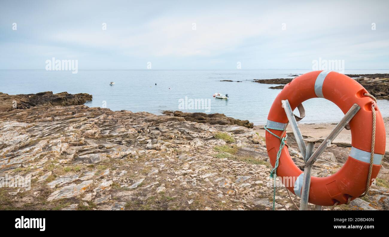 lifebuoy at sea in a small port on an island in France Stock Photo - Alamy