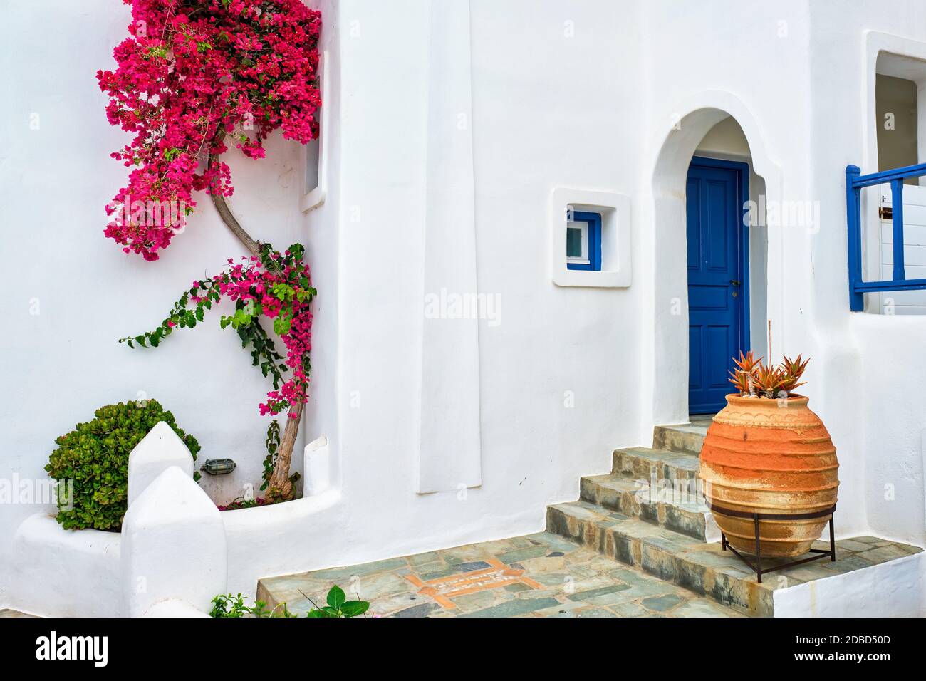 Picturesque narrow street with traditional whitewashed houses with ...