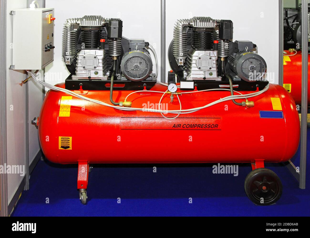 Double engine air compressor in service garage Stock Photo - Alamy