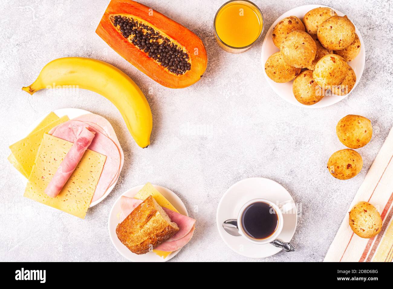 Traditional Brazilian breakfast - cheese bread, coffee, ripe fruit, top ...