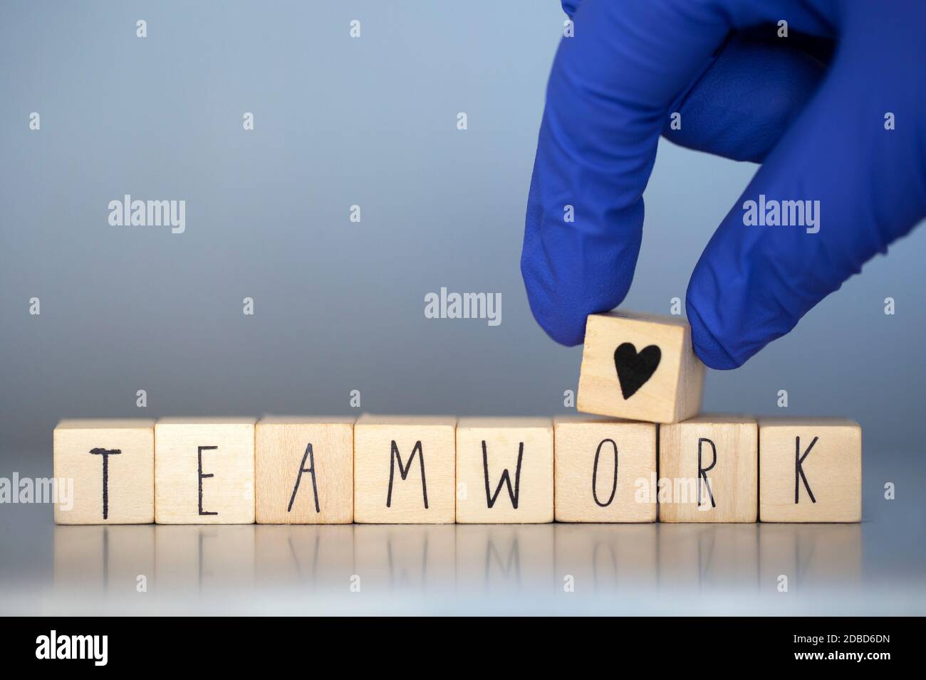 Wooden cubes with the words Team Work for business concept or health ...