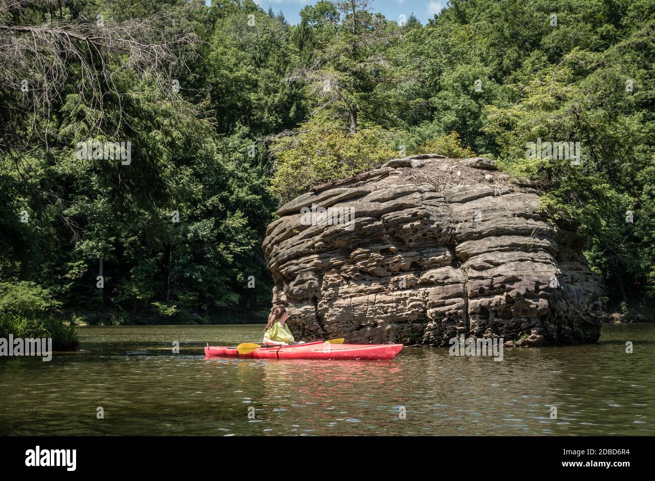 Kayaker looking at a rock formation on Grayson Lake in Kentuky Stock ...