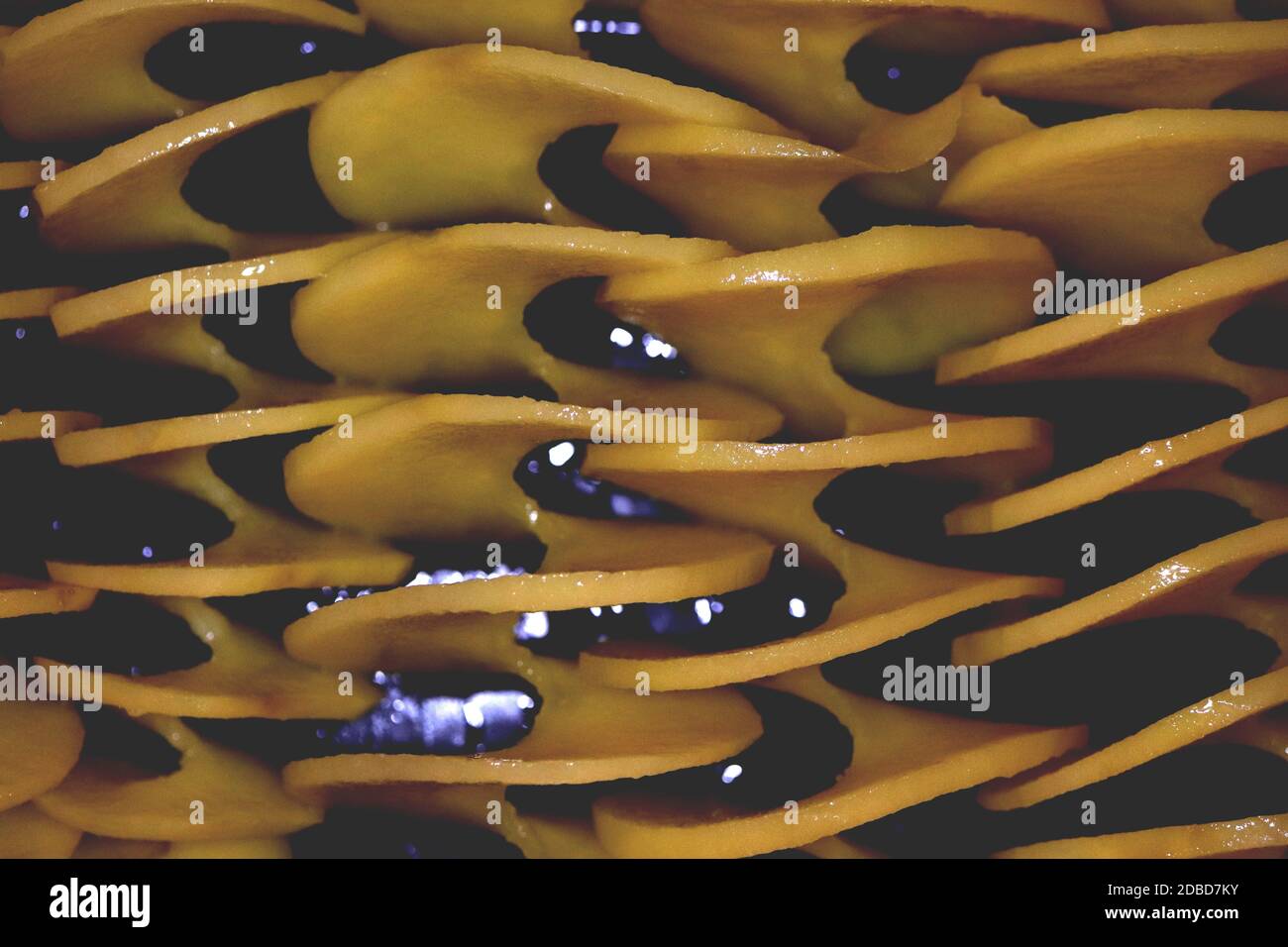 Raw spiral potato background. Vegetable cook idea. Loop slices potatoes ...