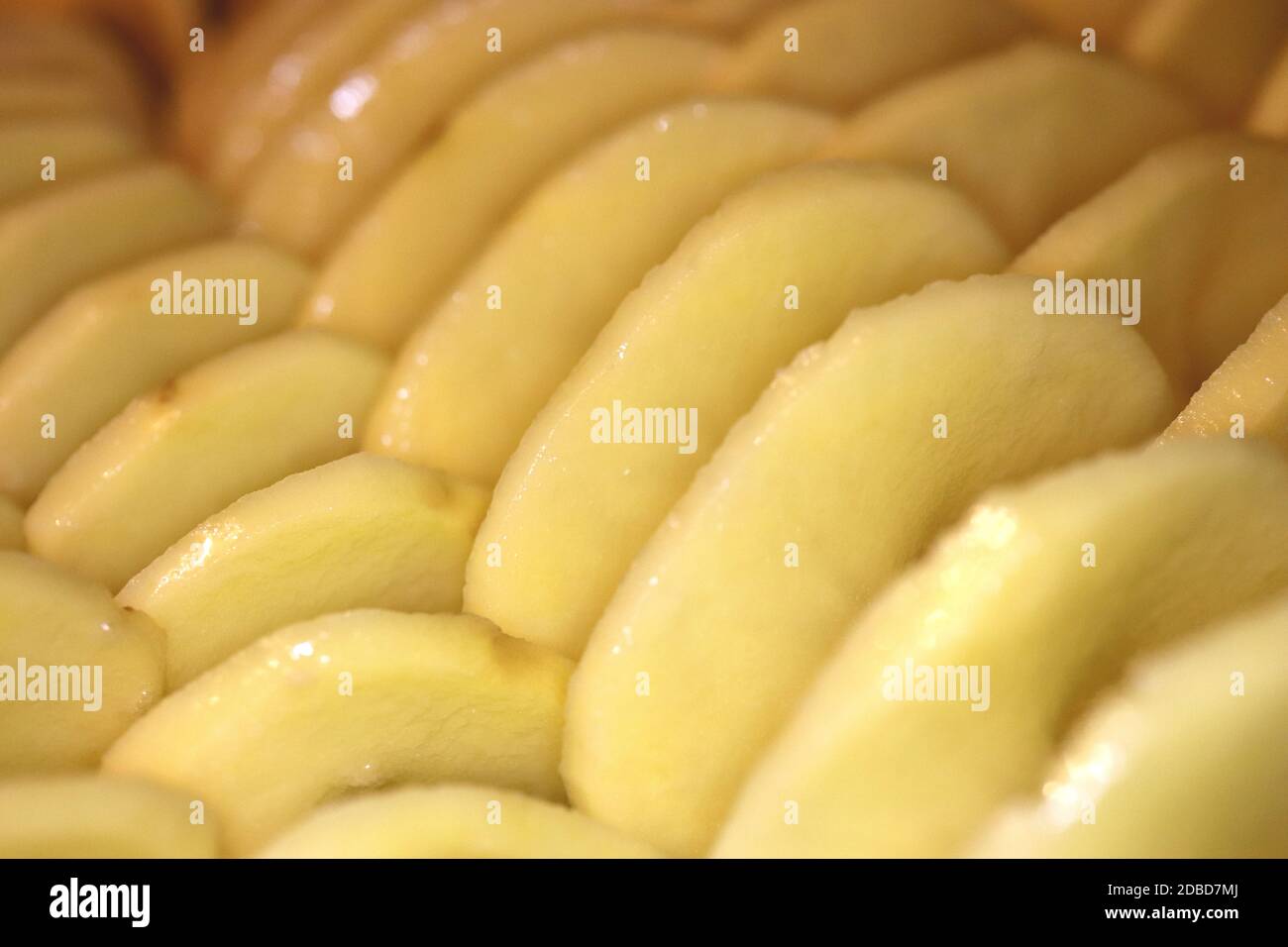 Raw spiral potato background. Vegetable cook idea. Loop slices potatoes ...