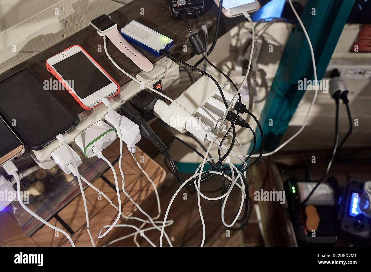 Lots of chargers for devices tangled in a crowded corner Stock Photo ...