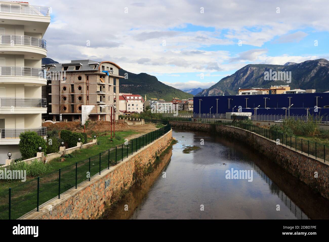 Old river channel descending from the mountains. New buildings are ...