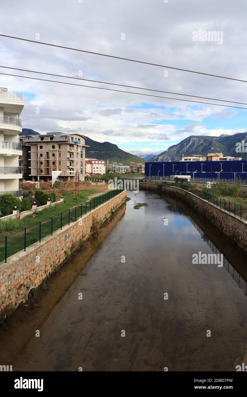 Old river channel descending from the mountains. New buildings are ...