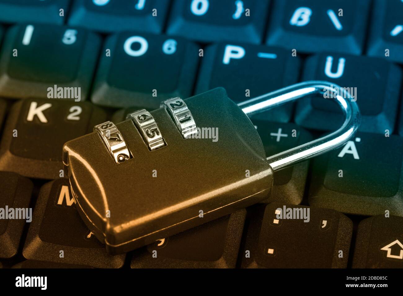 A padlock on a keyboard - symbol foto - save Stock Photo - Alamy