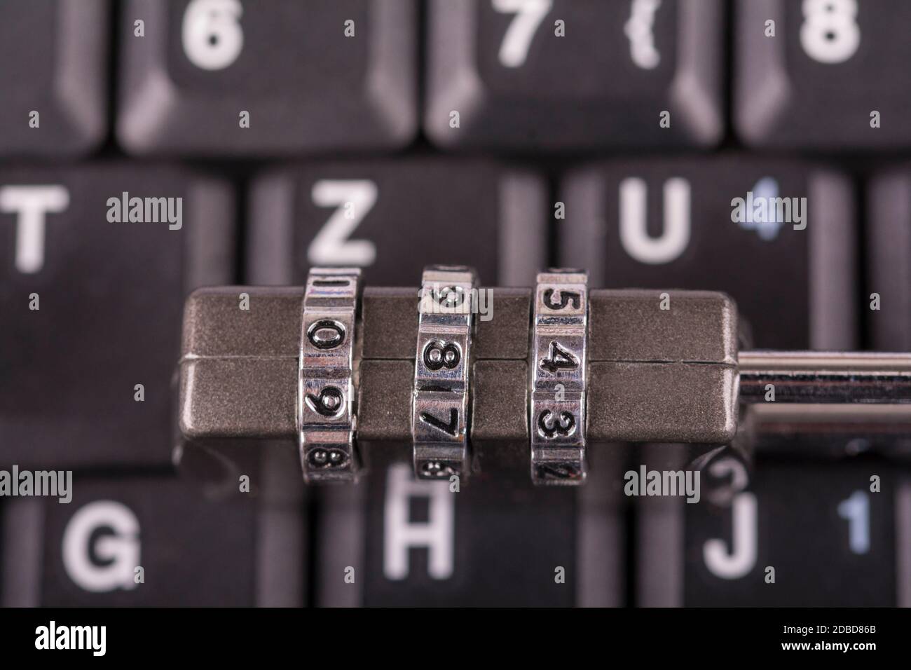 A padlock on a keyboard - symbol foto - save Stock Photo - Alamy