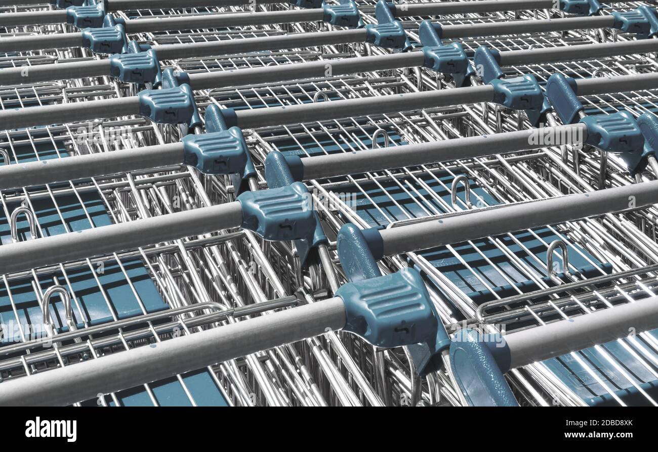 Light blue shopping trolleys in a superstore Stock Photo - Alamy