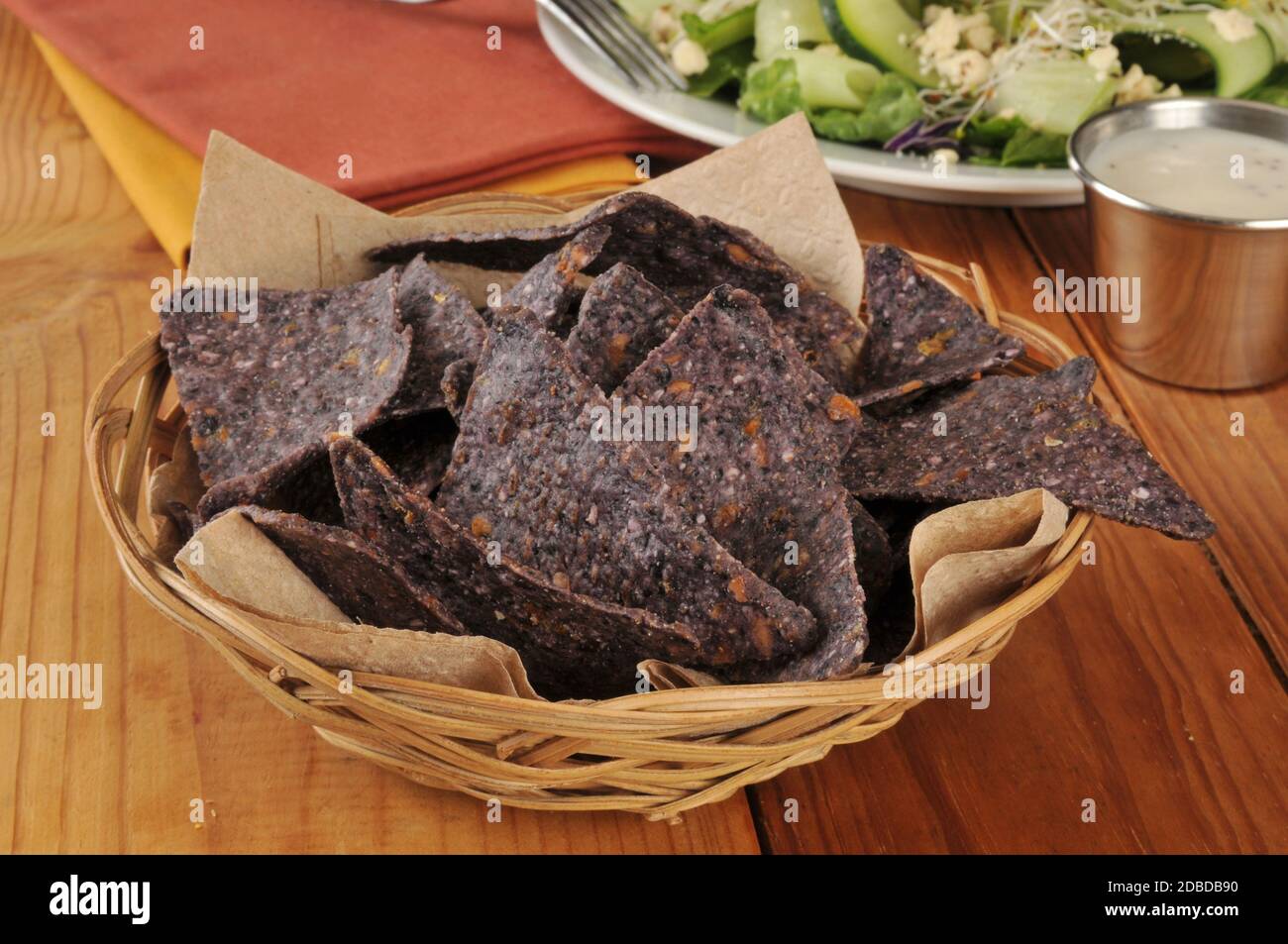 A basket of tortilla chips made with organic blue corn Stock Photo - Alamy