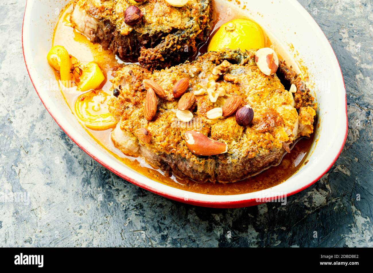 Roasted fish steak seasoned with nut sauce.Fried fish Stock Photo - Alamy