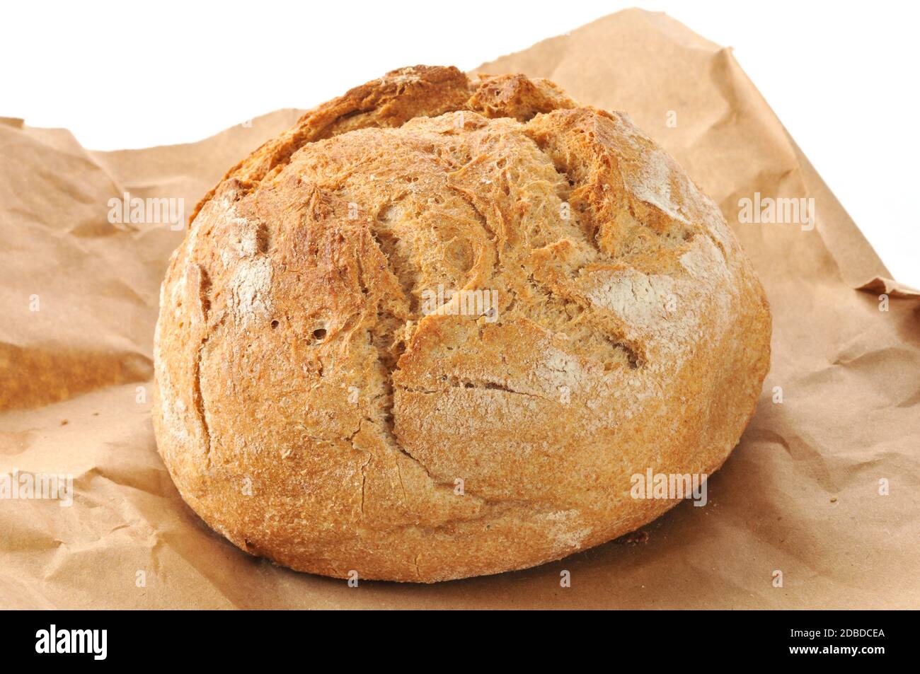 A loaf of rustic artisan whole wheat bread in wrapping paper Stock ...