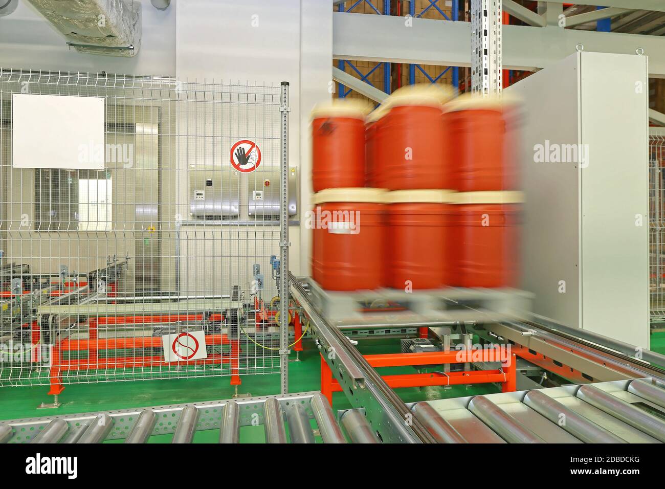 Plastic Barrels Moving at Automated Storage Conveyor in Warehouse Stock ...