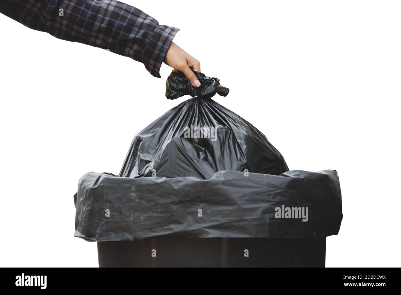 The man's hand is throwing the trash into the plastic bin Stock Photo ...