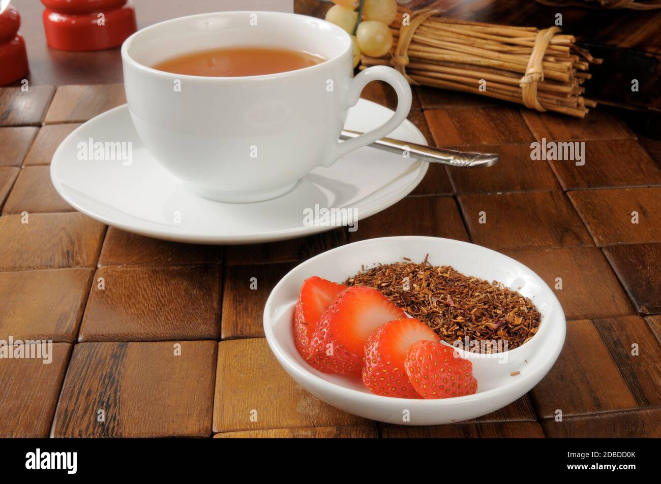 A cup of strawberry flavored rooibos tea with fresh strawberry Stock ...
