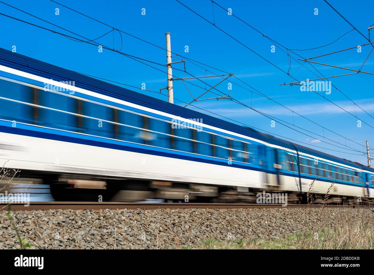 wagons of an express train passing along the tracks Stock Photo - Alamy