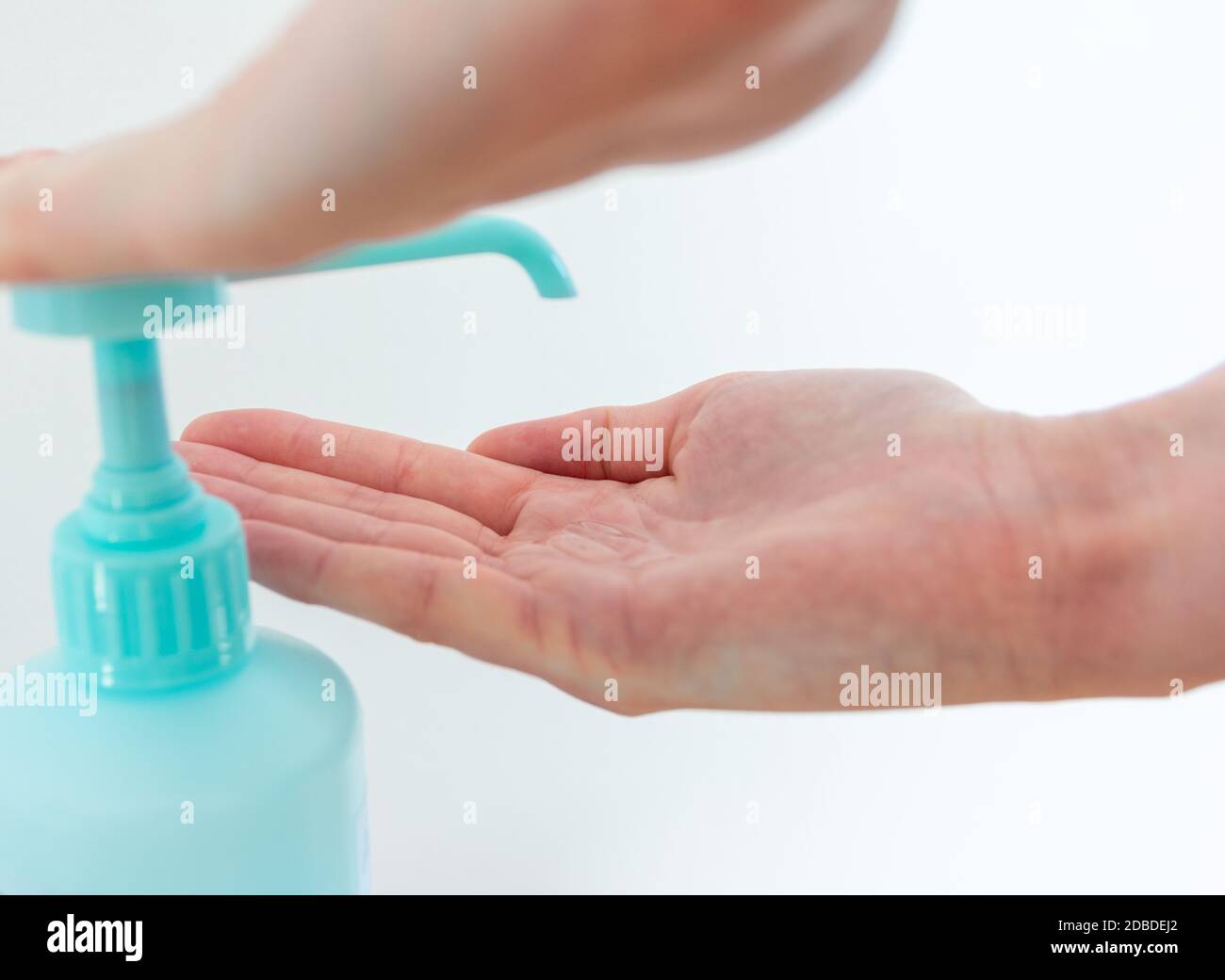 Woman washing hands with hand sanitizer alcohol antibacterial to ...