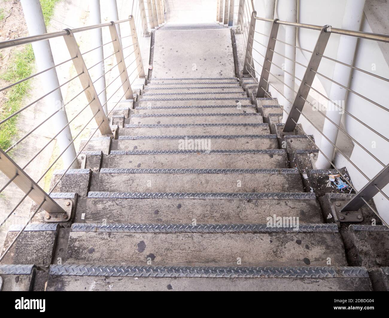 staircase for descending from footbridge. The concrete overpass for ...