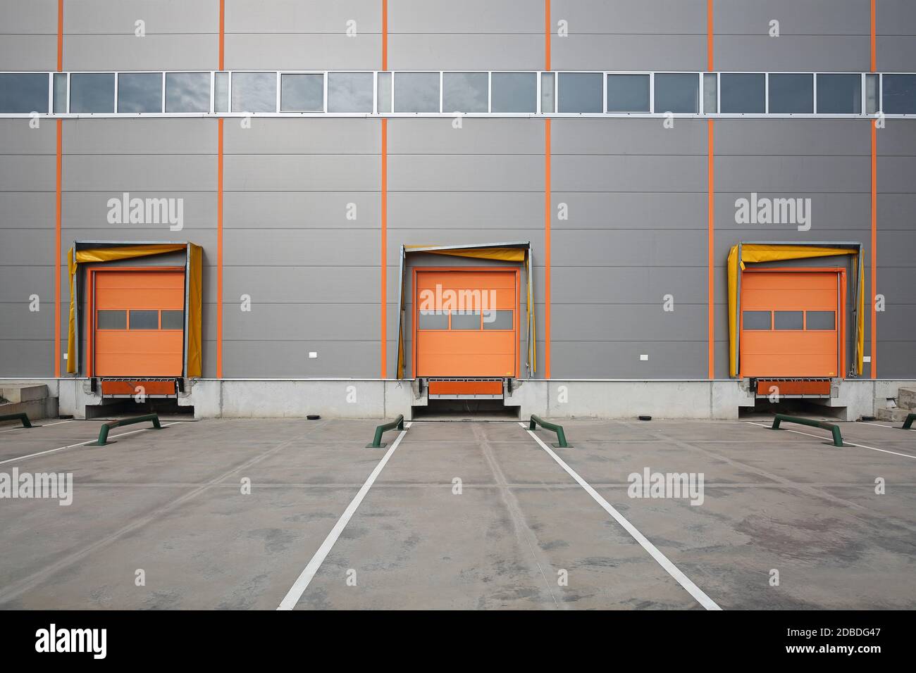 Three Cargo Doors at Warehouse Loading Dock Stock Photo - Alamy