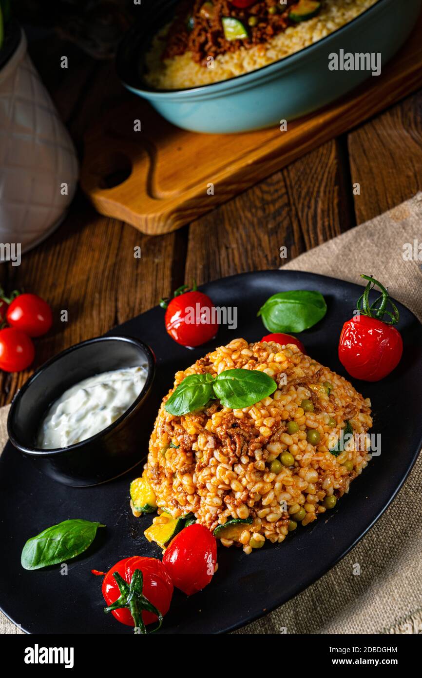 rustic bulgur fried with minced meat and vegetables Stock Photo - Alamy