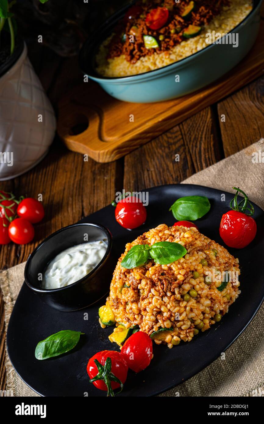 rustic bulgur fried with minced meat and vegetables Stock Photo - Alamy