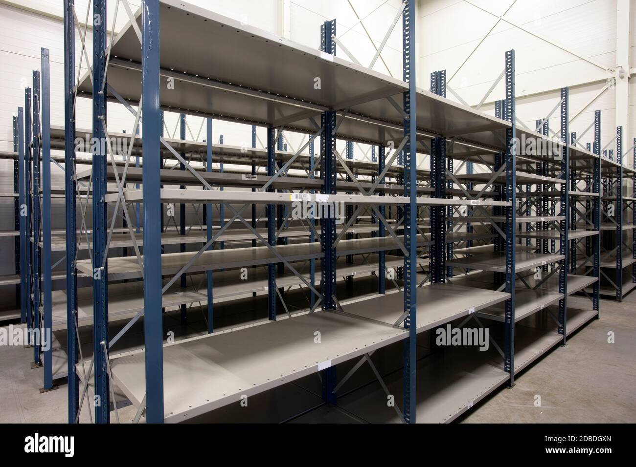 huge warehouse with empty racks inside for storage modern design, metal ...