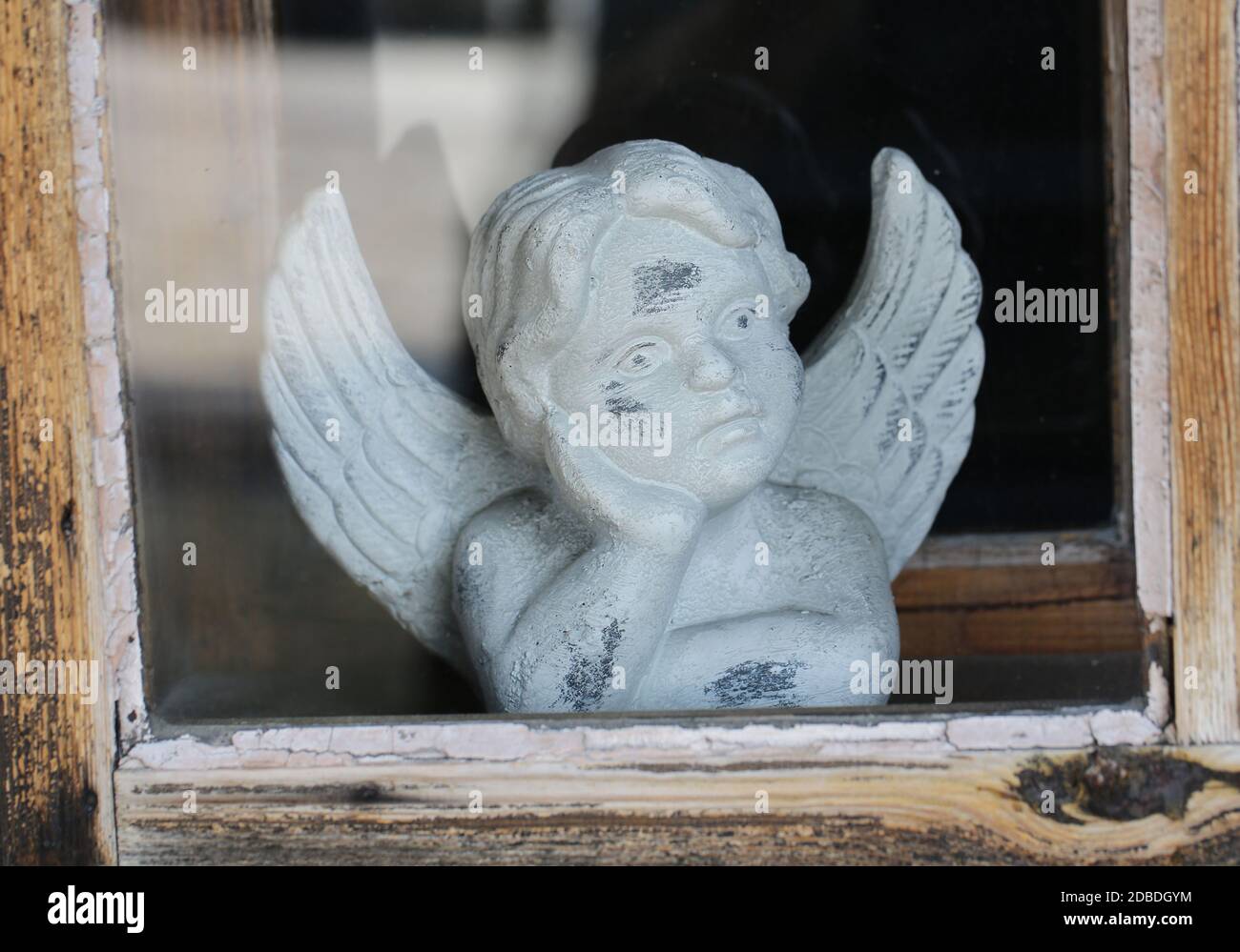 Angel statue in the old window Stock Photo - Alamy