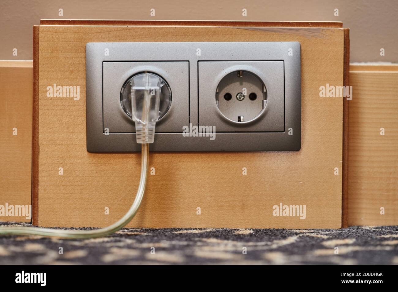 Electric outlet with cable connected Stock Photo - Alamy
