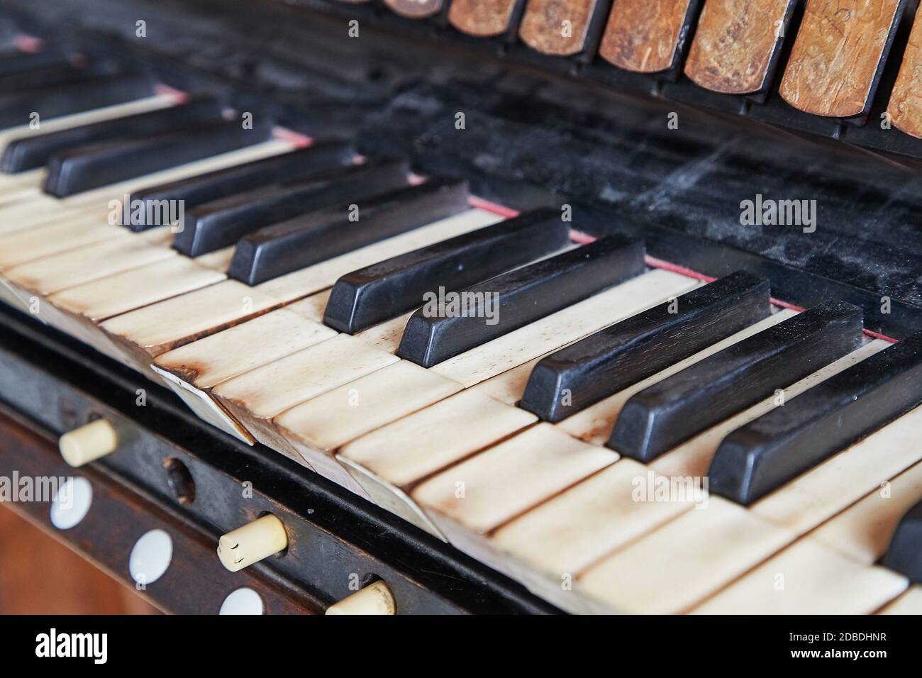 Keyboards of a church organ, old stained keys Stock Photo - Alamy