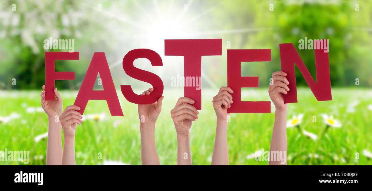 People Hands Holding Red German Word Fasten Means Fasting. Sunny Green ...