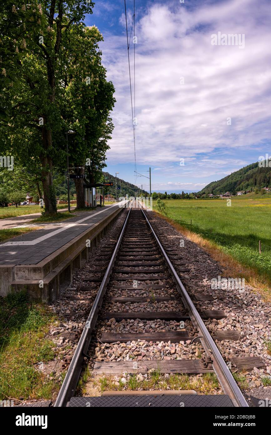 View along a small platform with railway tracks in the Black Forest in ...