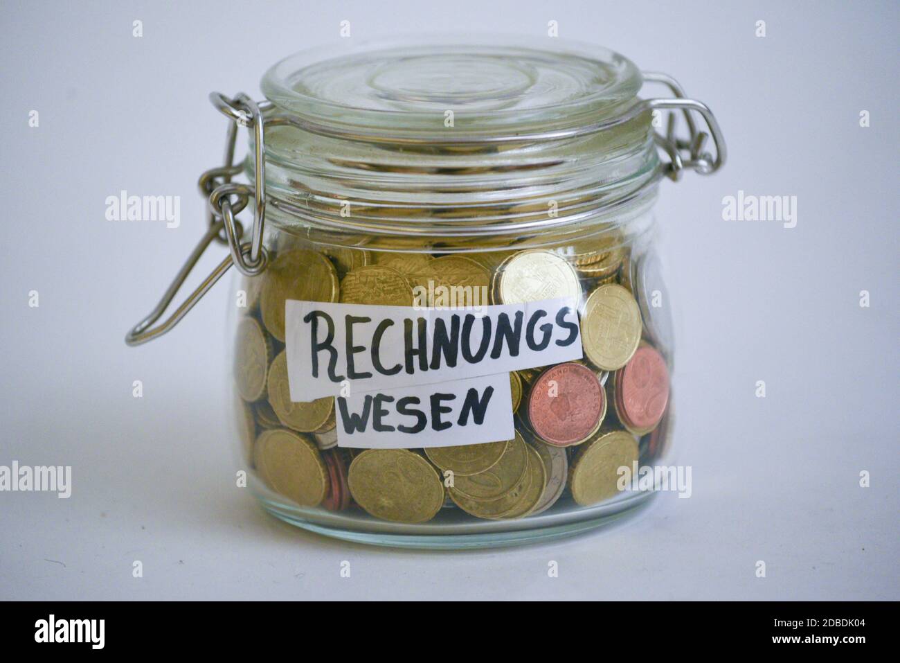 Jar with coins saying 'Rechnungswesen' (accounting Stock Photo - Alamy