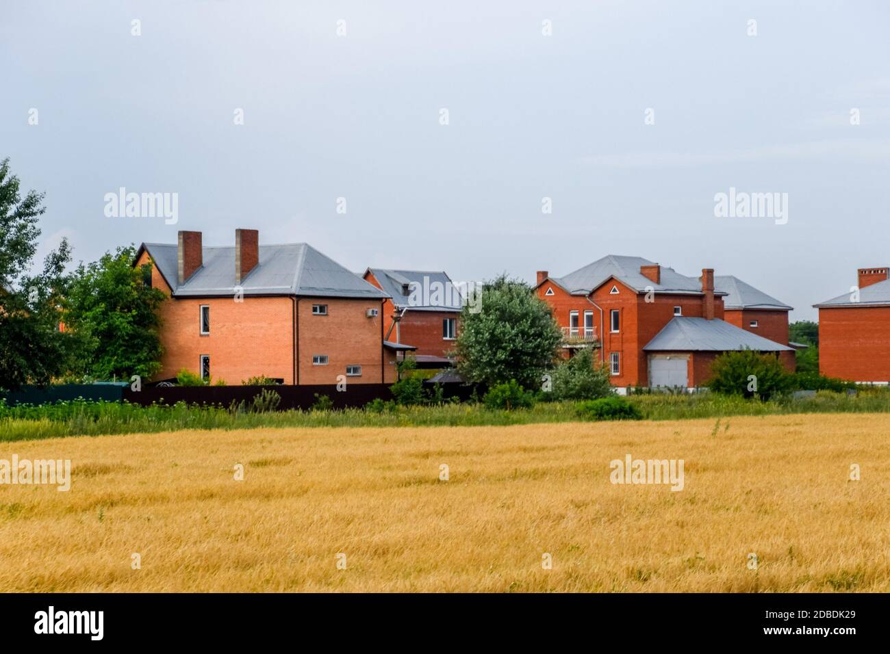 A cottage village of two-storey houses. Low-rise development Stock ...
