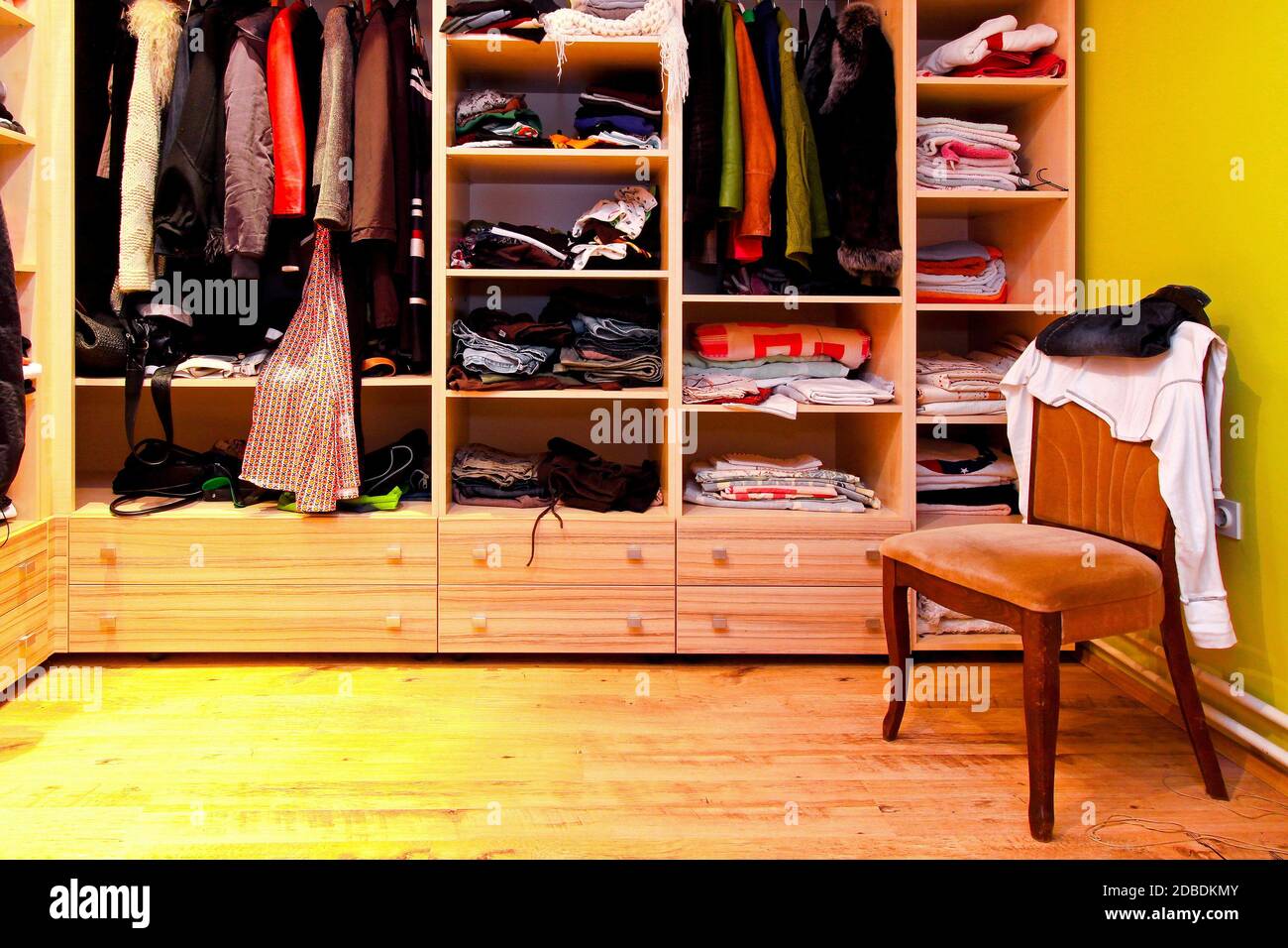 Corner of built in wardrobe with open shelves Stock Photo - Alamy