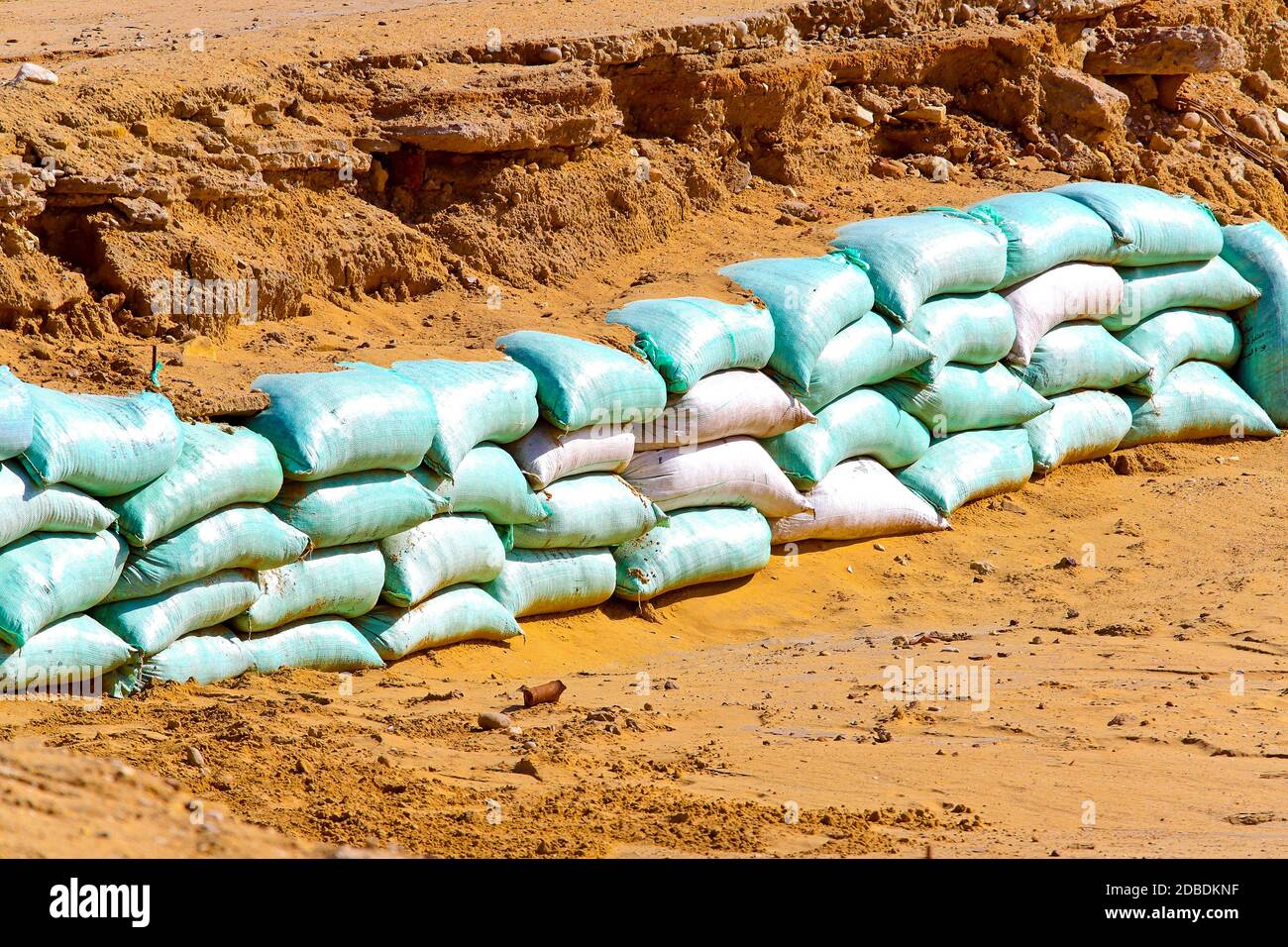Sand bags barrier for water flood protection Stock Photo - Alamy