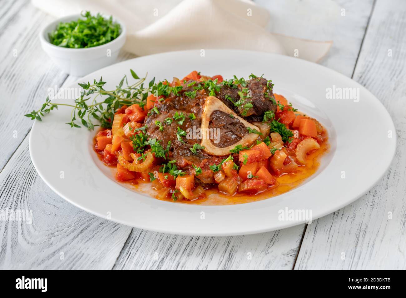 Ossobuco - Italian cuisine specialty with veal shanks and vegetables ...