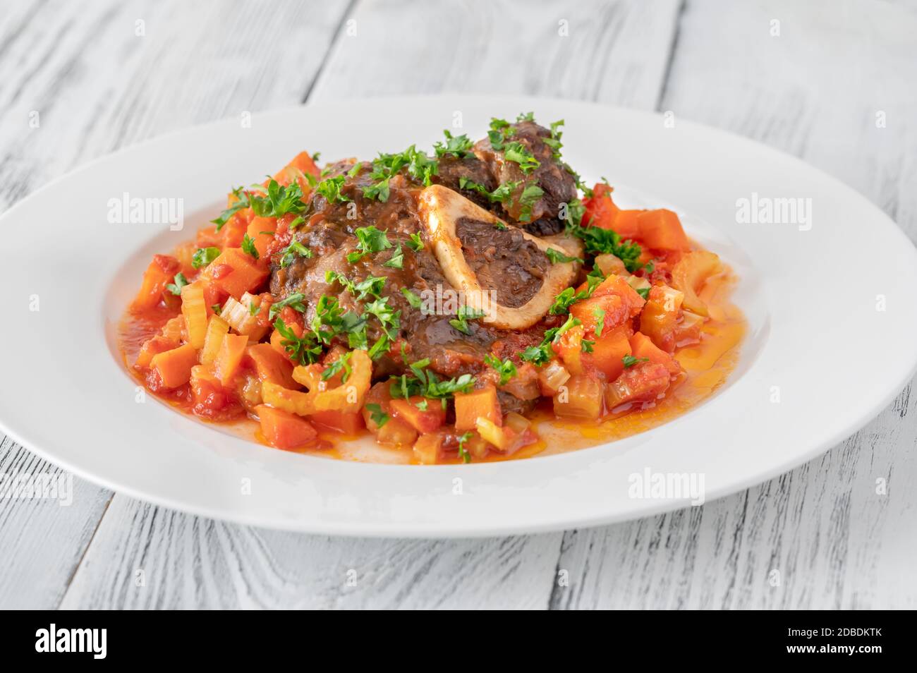 Ossobuco - Italian cuisine specialty with veal shanks and vegetables ...