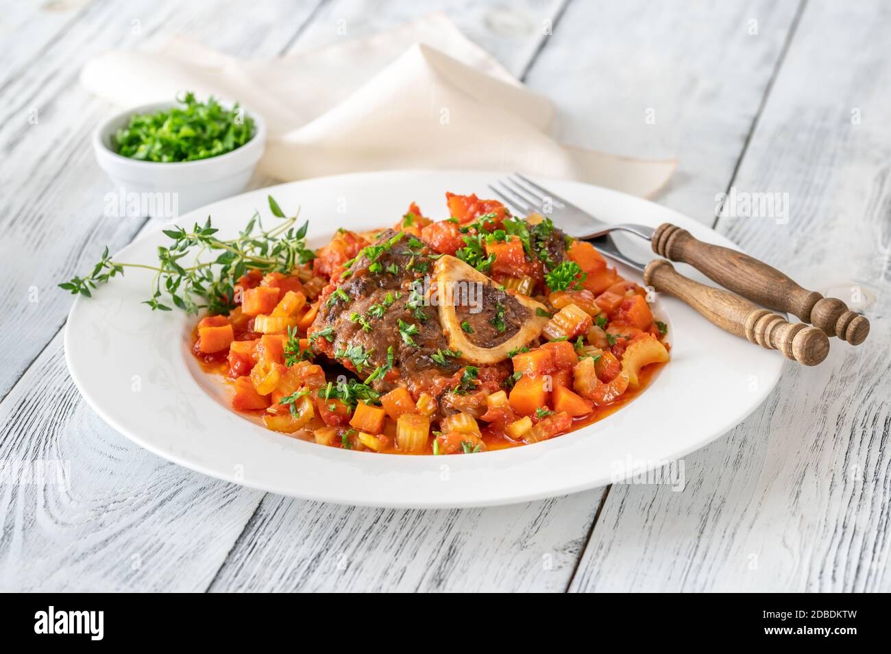 Ossobuco - Italian cuisine specialty with veal shanks and vegetables ...