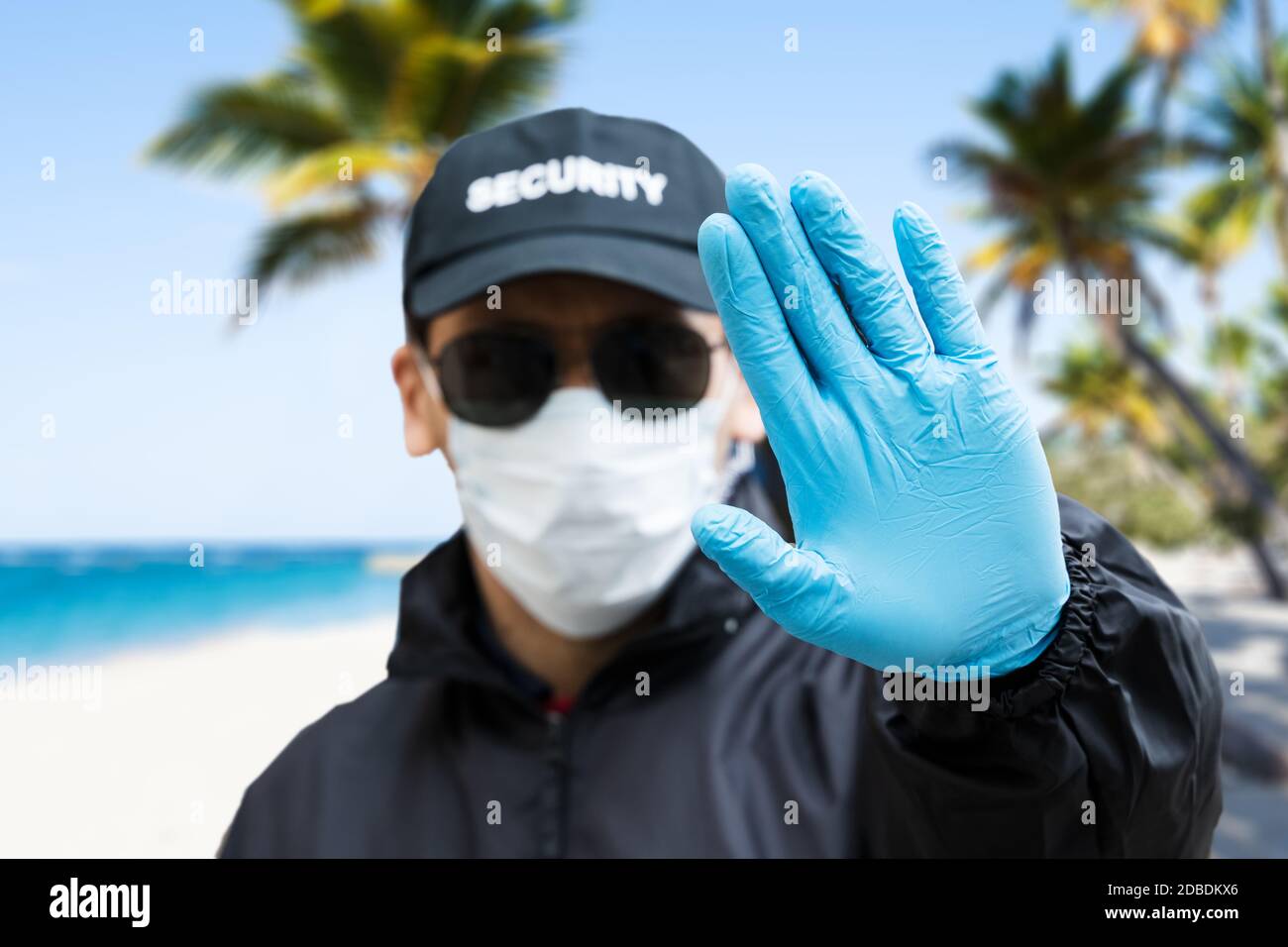 Security Guard Making Hand Stop Gesture At The Beach Stock Photo - Alamy